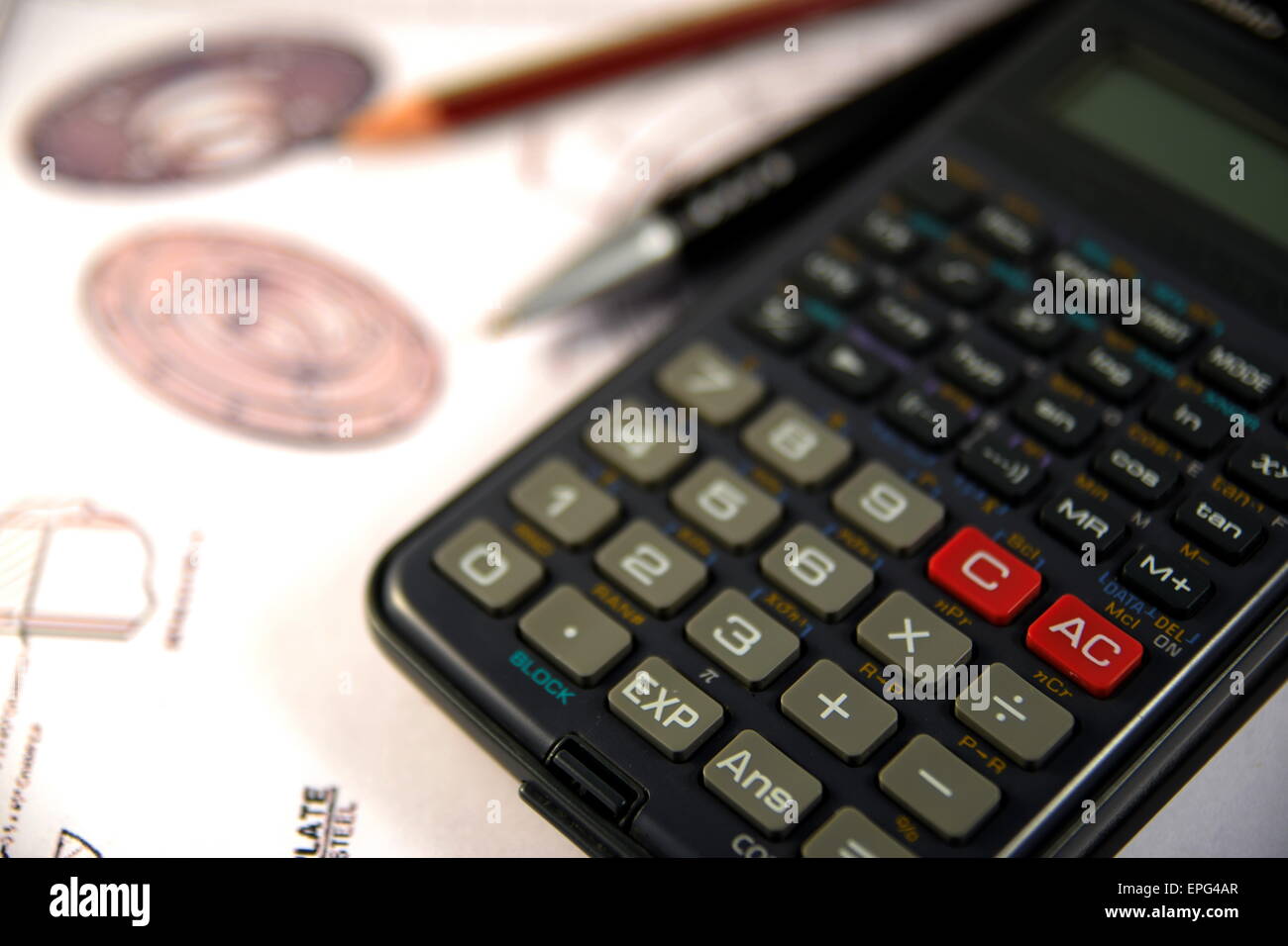 Scientific calculator, Pen and Pencil over the Engineering Drawing Map ...