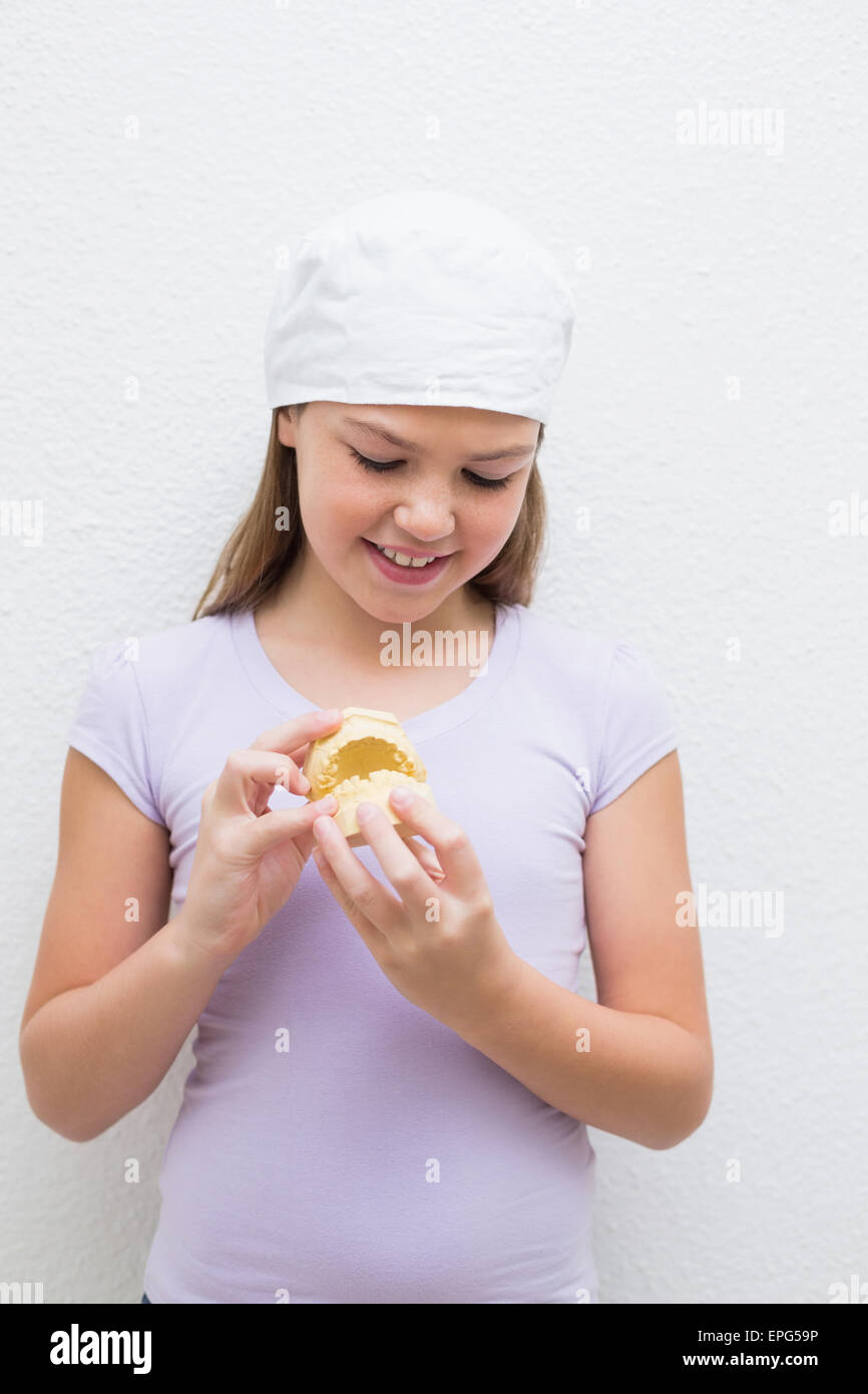 Little girl holding model teeth Stock Photo - Alamy