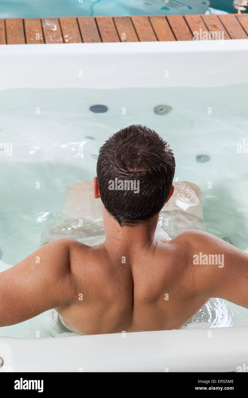 Man inside the jacuzzi Stock Photo - Alamy