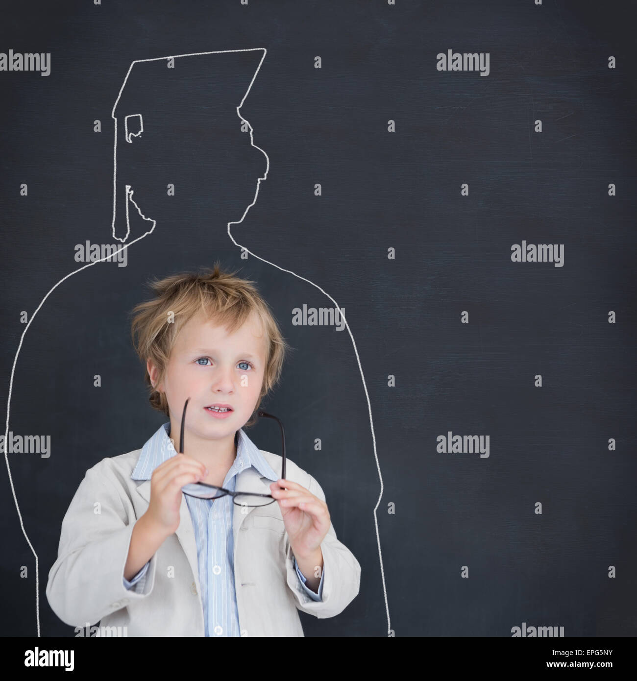 Composite image of cute pupil with graduate outline Stock Photo - Alamy