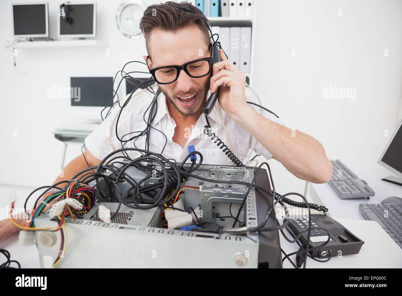 Angry computer engineer making a call Stock Photo - Alamy