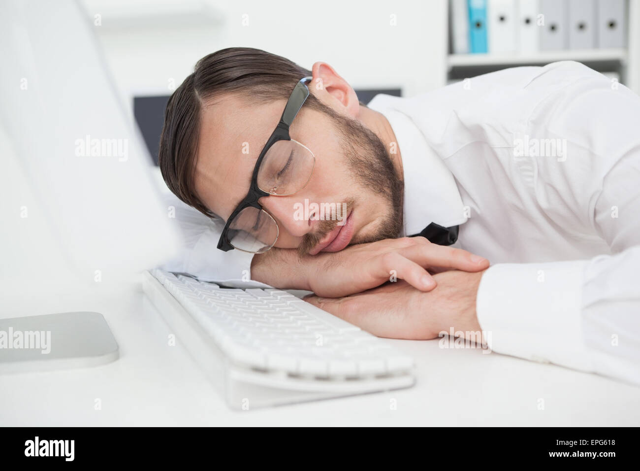 Nerdy businessman sleeping on keyboard Stock Photo - Alamy Nerdy businessman sleeping on keyboard Stock Photo - Alamy