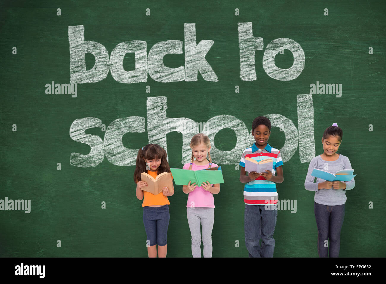 Composite image of elementary pupils reading Stock Photo - Alamy