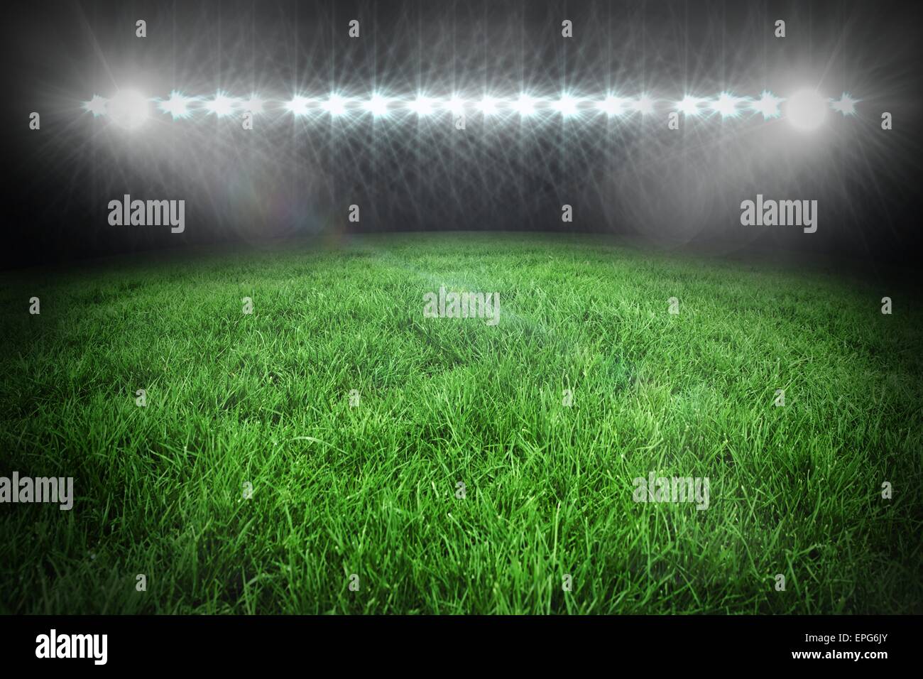 Football pitch under spotlights Stock Photo - Alamy