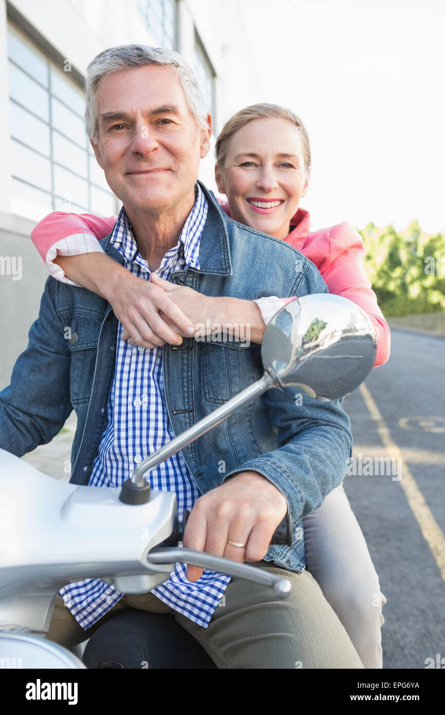 Woman riding a moped and smiling hi-res stock photography and images ...