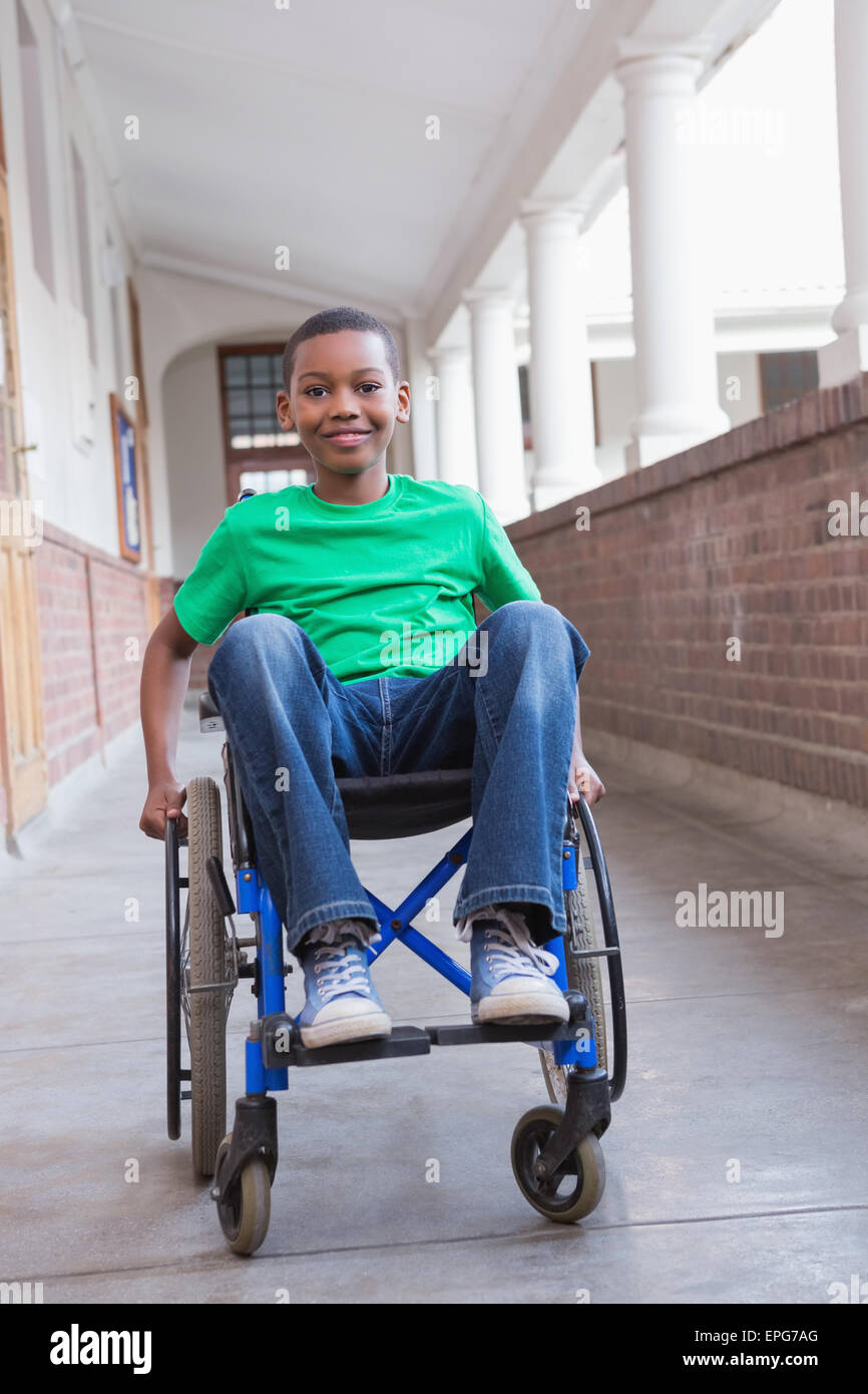 Cute disabled pupil smiling at camera in hall Stock Photo - Alamy