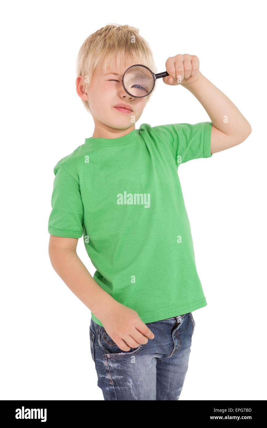 Cute little boy looking through magnifying glass Stock Photo - Alamy