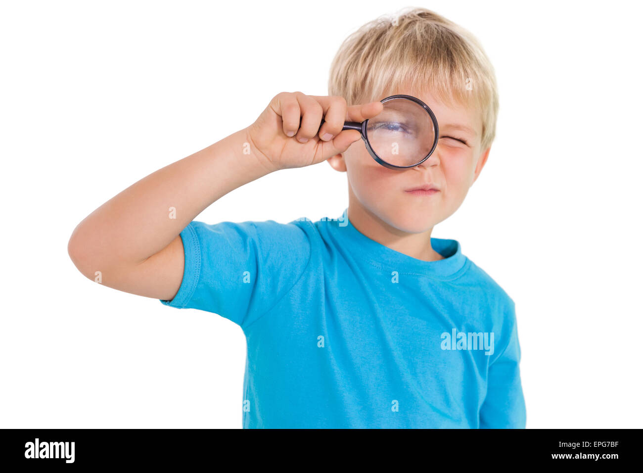 Cute little boy looking through magnifying glass Stock Photo - Alamy