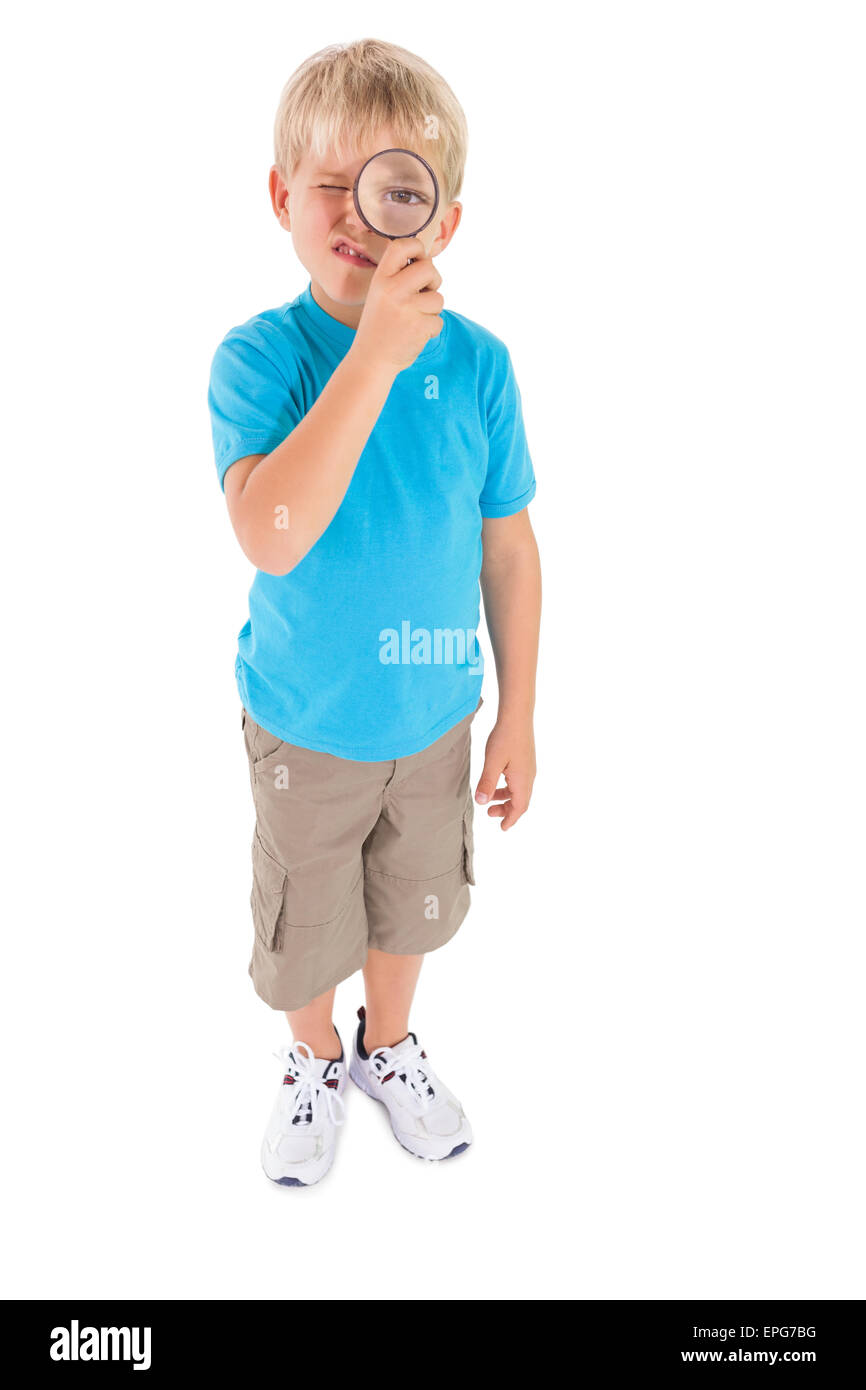 Cute little boy looking through magnifying glass Stock Photo - Alamy