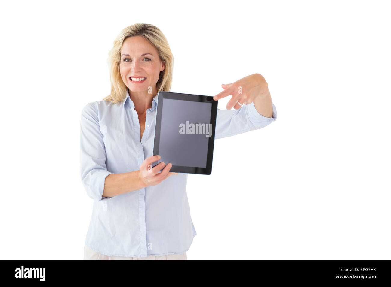 Happy blonde pointing to her tablet pc screen Stock Photo - Alamy