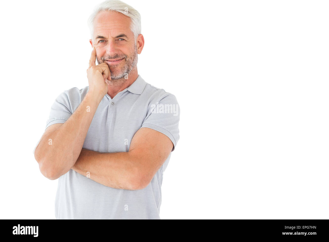 Smiling man posing with arms crossed Stock Photo - Alamy