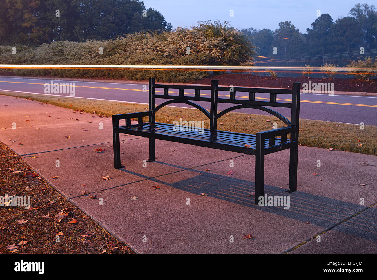 Bench near the road Stock Photo - Alamy