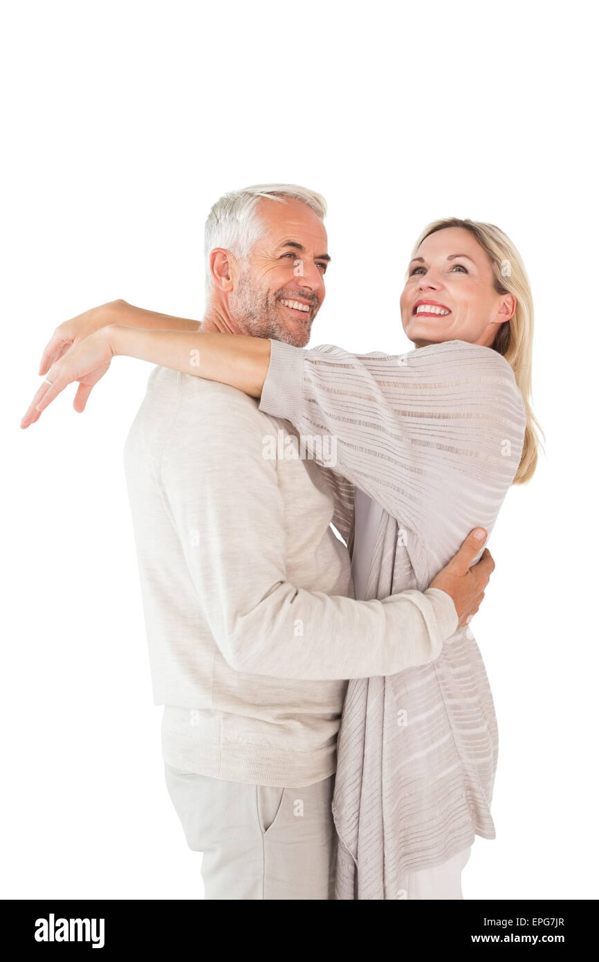 Happy couple standing and hugging Stock Photo - Alamy