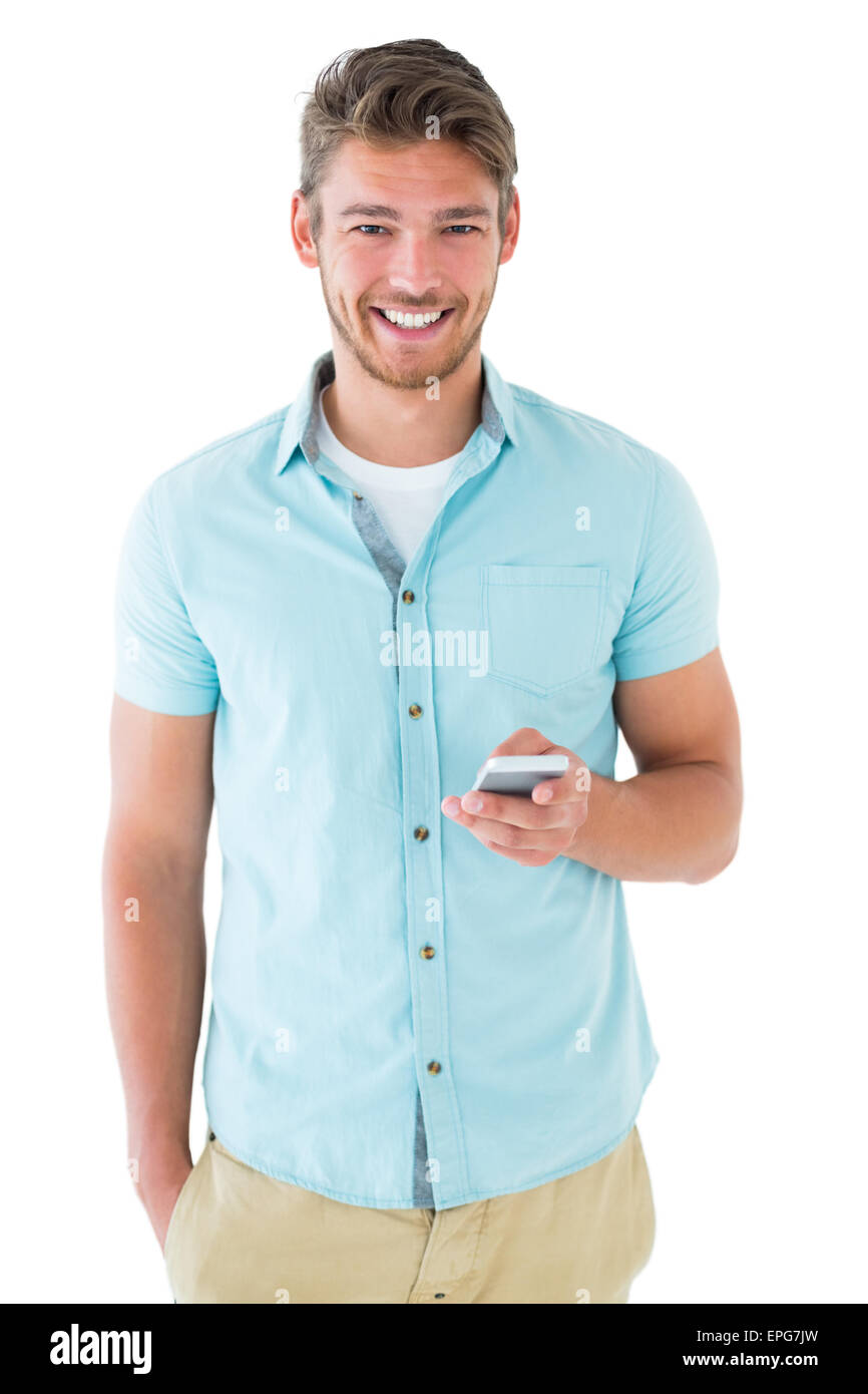 Handsome young man using his smartphone Stock Photo - Alamy