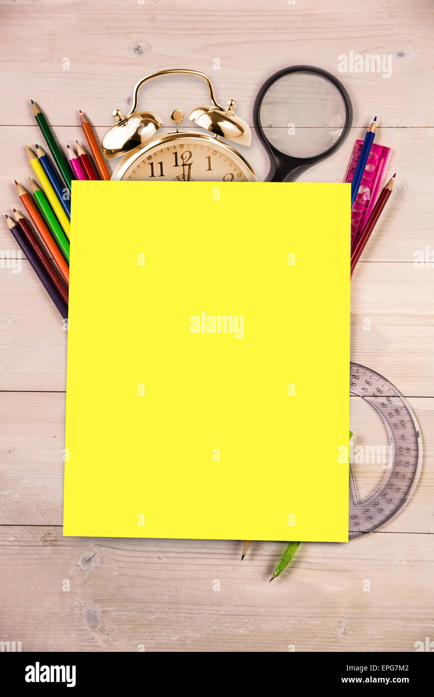 Students desk with yellow page Stock Photo - Alamy