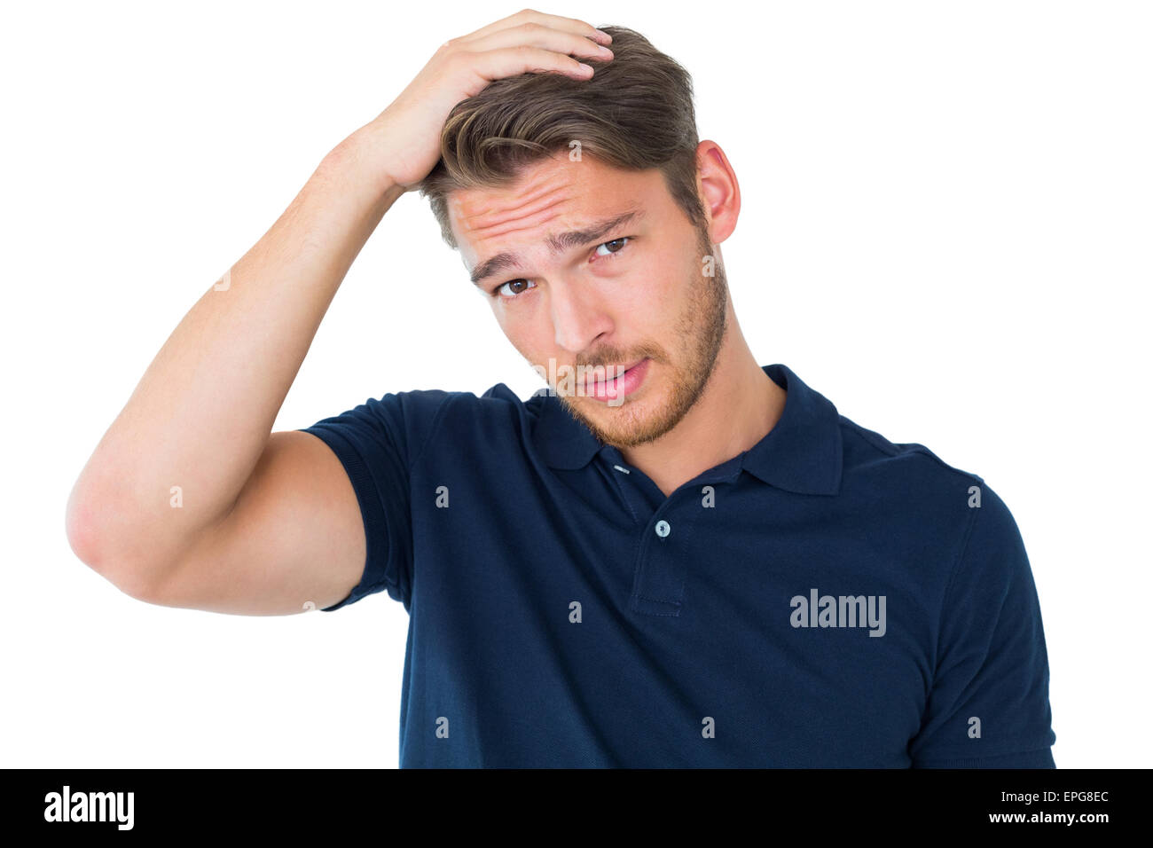 Handsome young man looking confused Stock Photo - Alamy