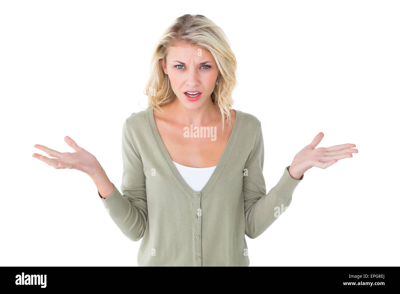 Confused woman shrugging shoulders standing hi-res stock photography ...