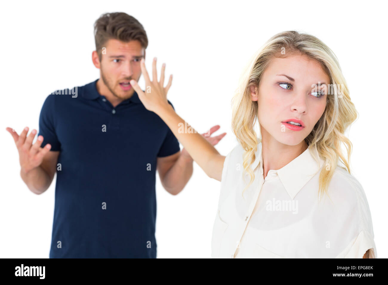 Young blonde not listening to boyfriend Stock Photo - Alamy