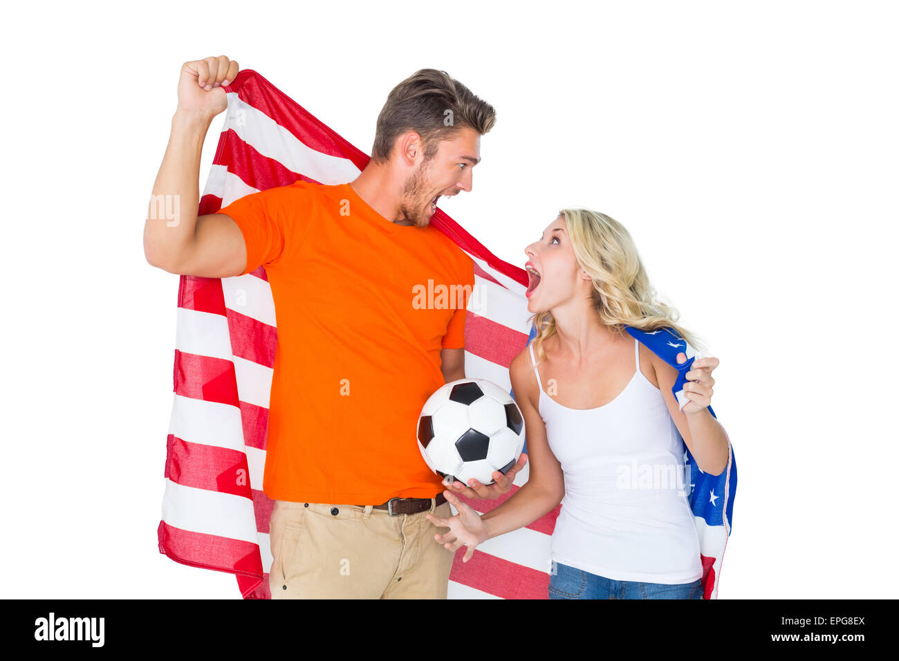 Excited football fan couple holding usa flag Stock Photo - Alamy