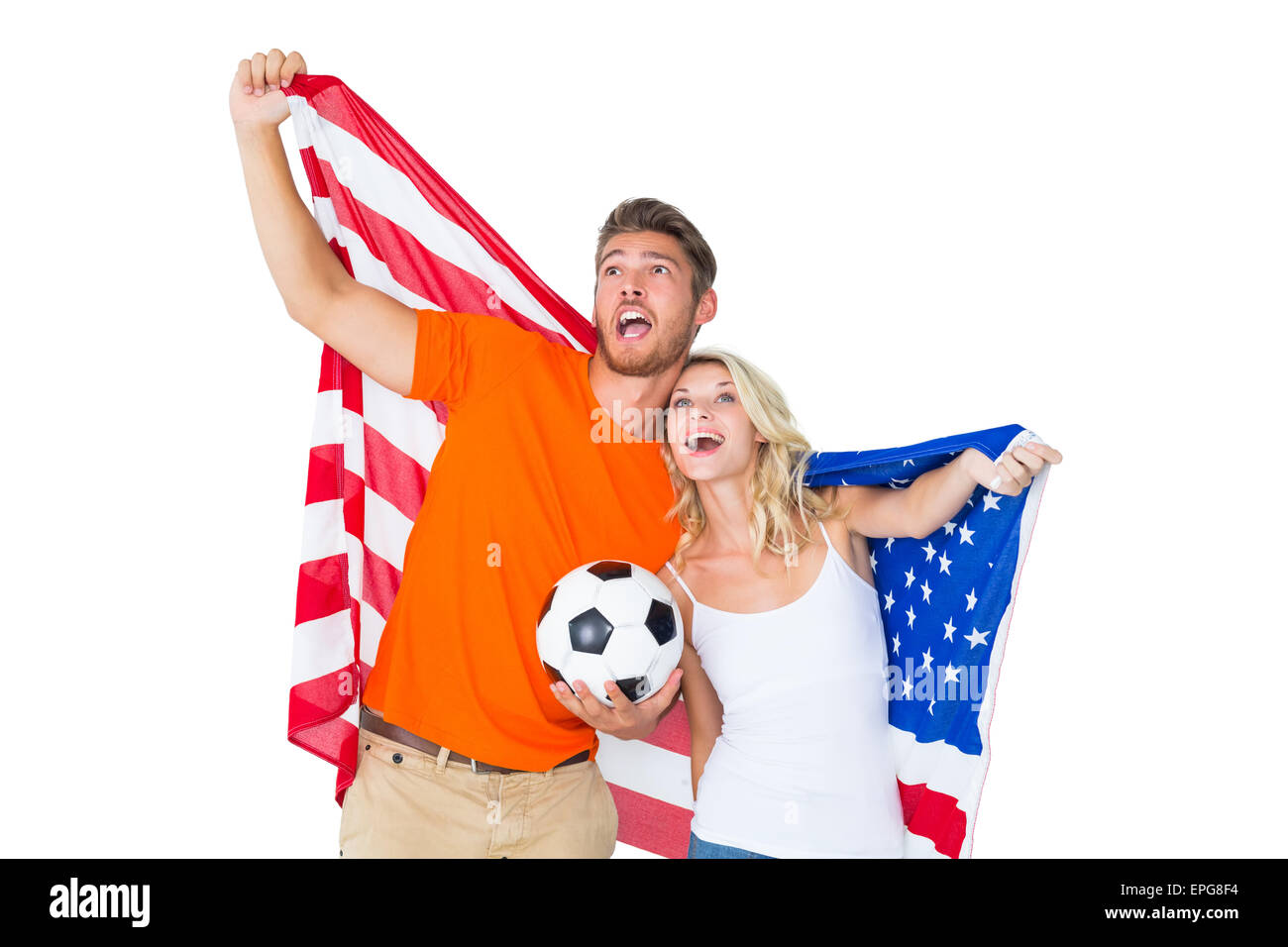 Excited football fan couple holding usa flag Stock Photo - Alamy