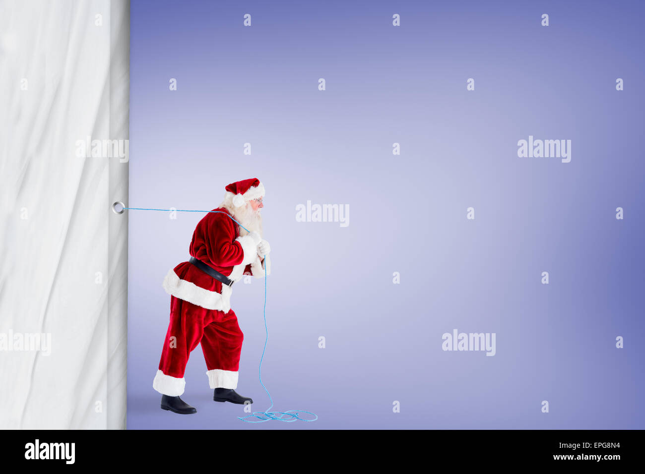 Santa claus pulling a rope Stock Photo - Alamy