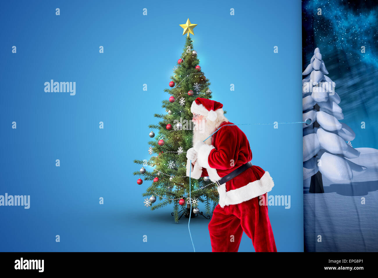 Composite image of santa claus pulling rope Stock Photo - Alamy