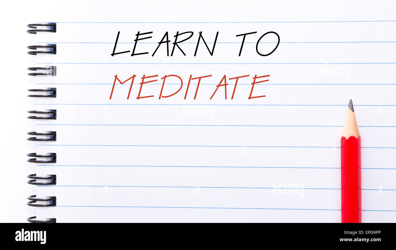 Learn to Meditate Text written on notebook page, red pencil on the ...