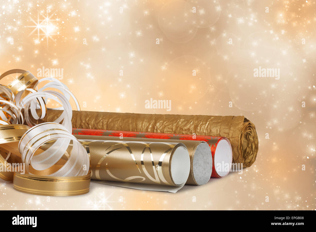 Rolls of multicolored wrapping paper for gifts with a streamer on a ...