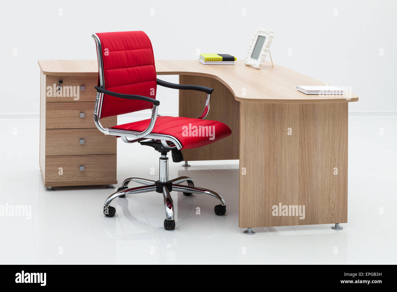 wood desk and red armchair Stock Photo - Alamy