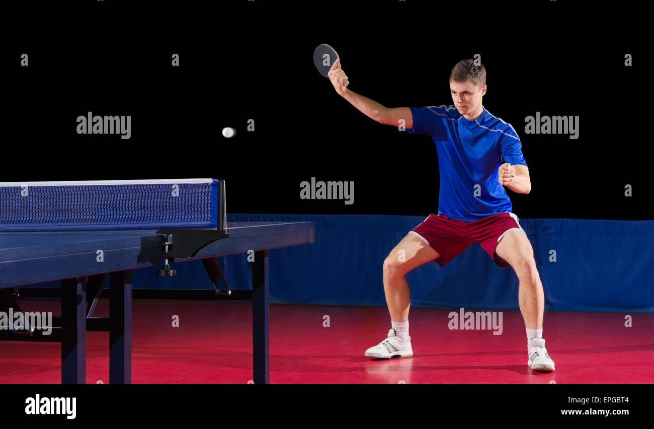 Table tennis player isolated on black Stock Photo - Alamy