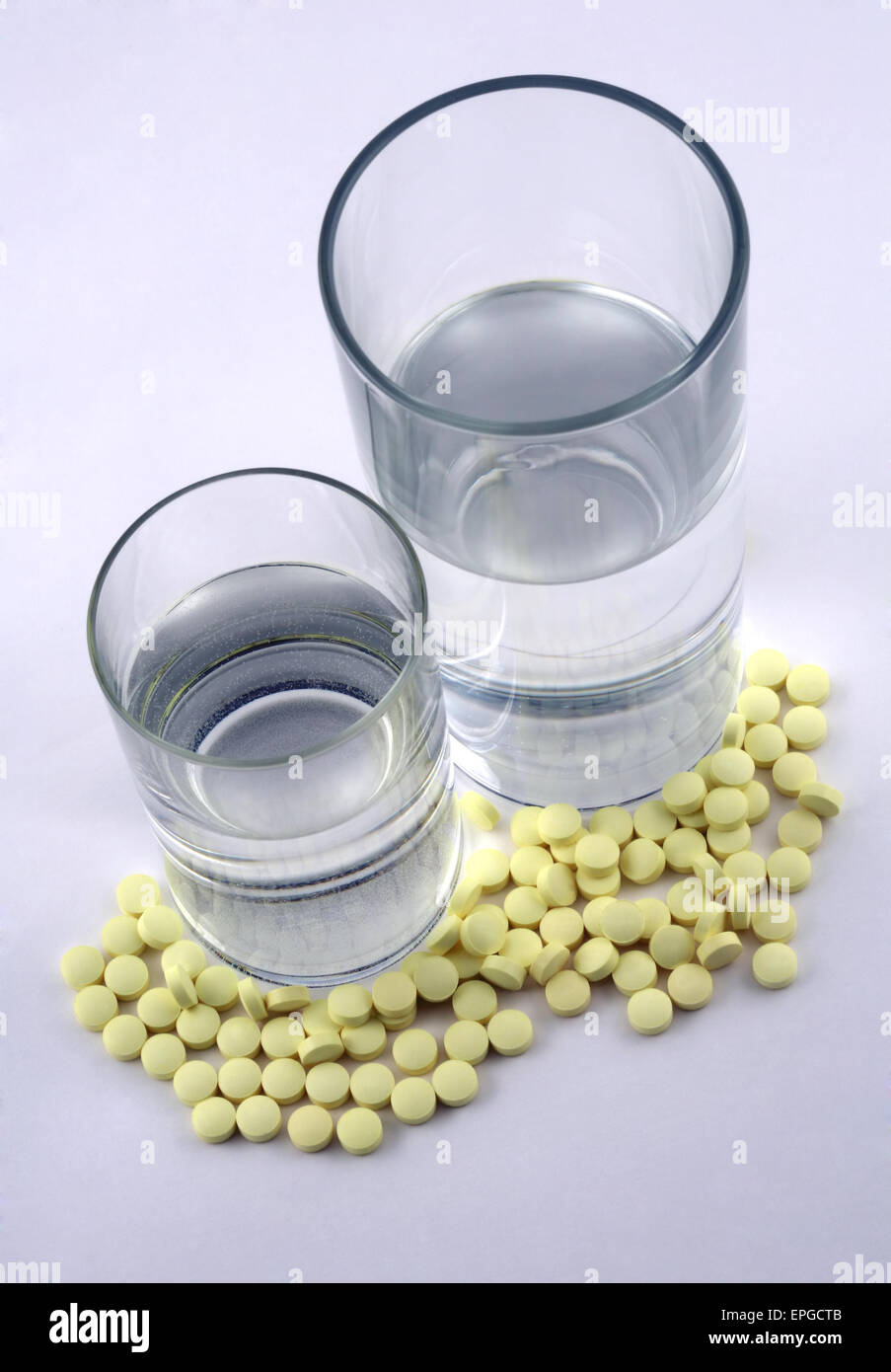 Tablets and a glass Stock Photo - Alamy