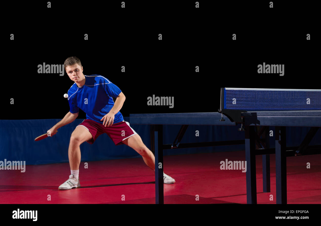 Table tennis player isolated on black Stock Photo - Alamy