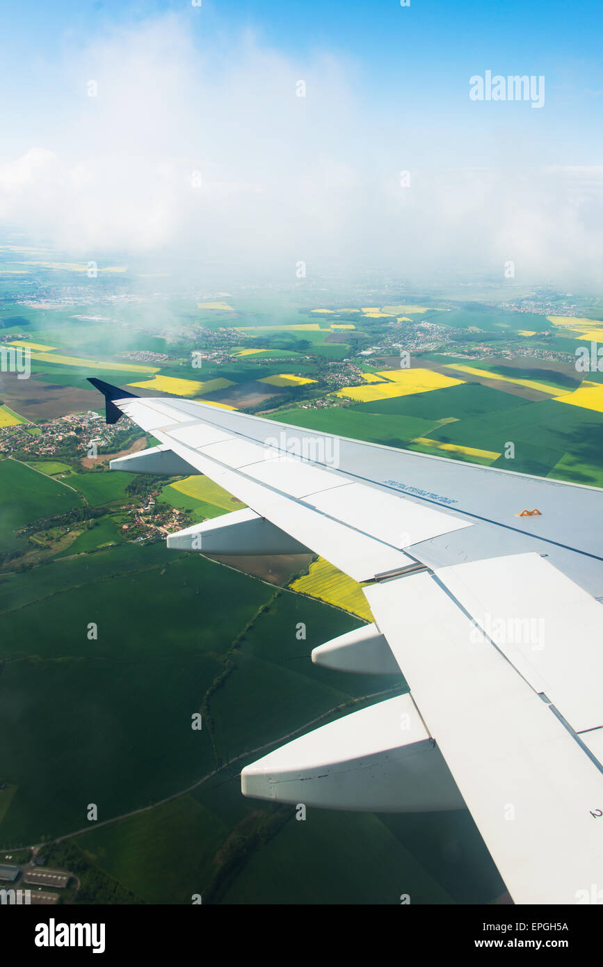 Airplane wing out of window Stock Photo - Alamy