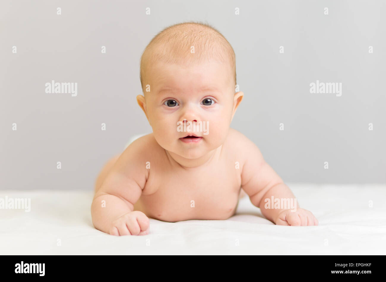 Little baby on grey background Stock Photo - Alamy