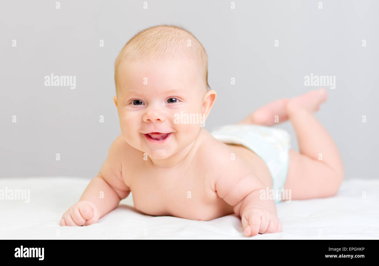 Little baby on grey background Stock Photo - Alamy