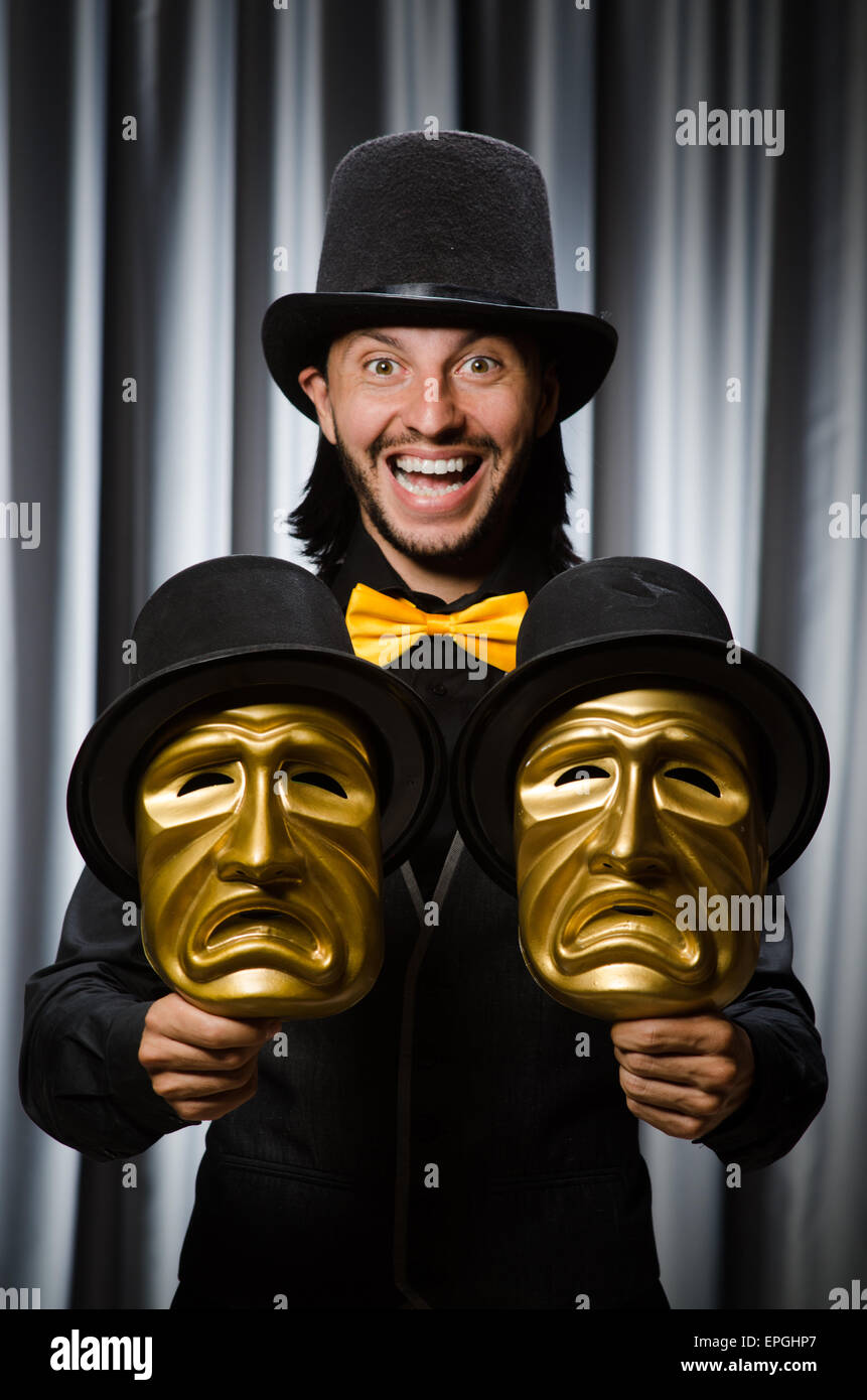 Funny concept with theatrical mask Stock Photo - Alamy