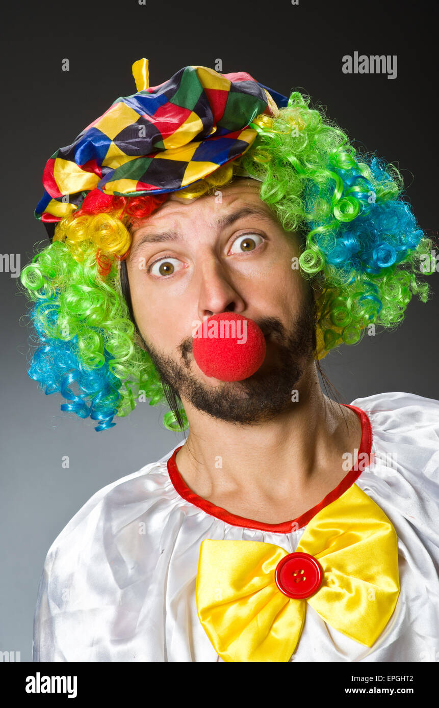 Funny clown in colourful costume Stock Photo - Alamy