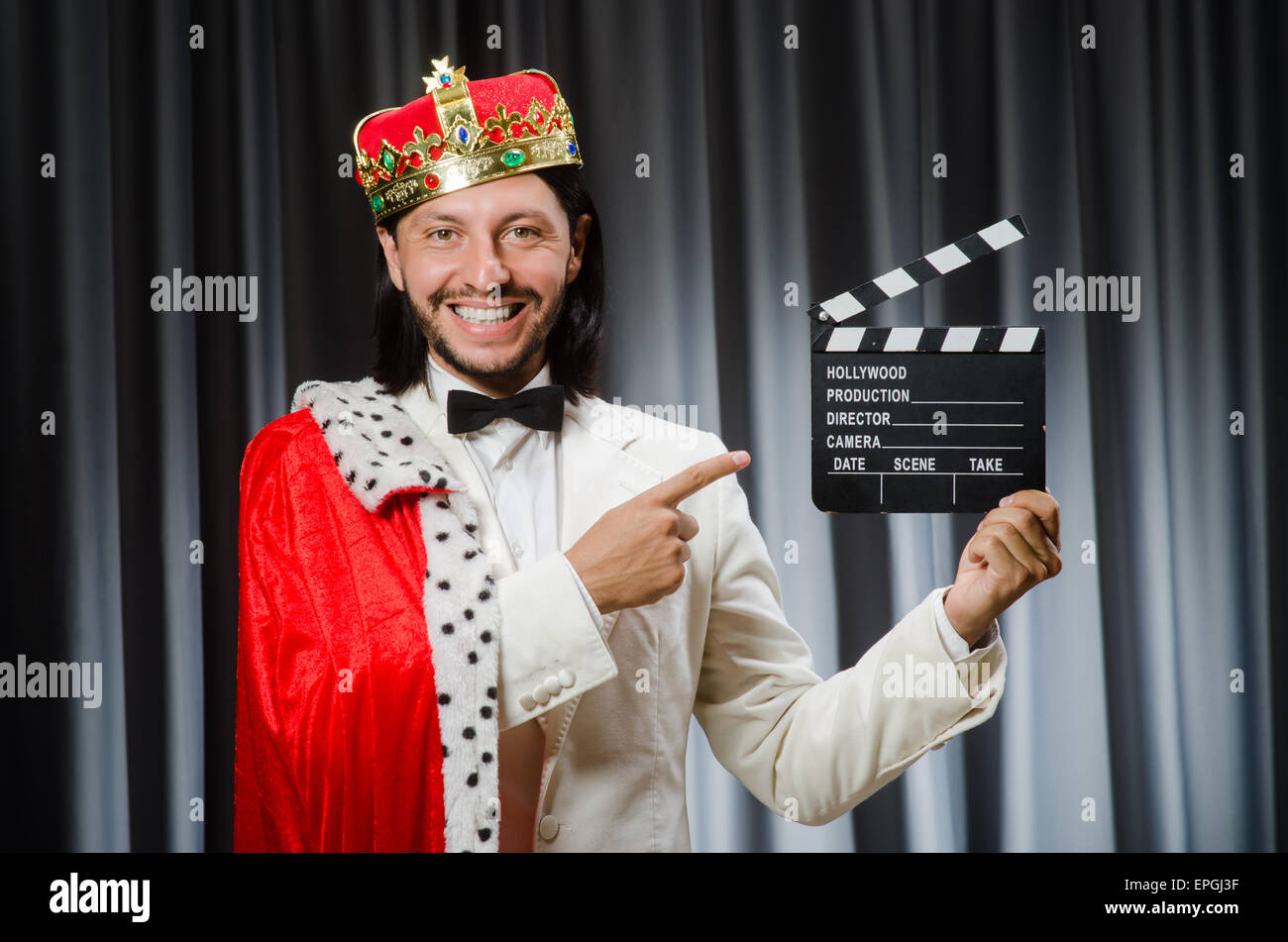 King with movie board in funny concept Stock Photo - Alamy