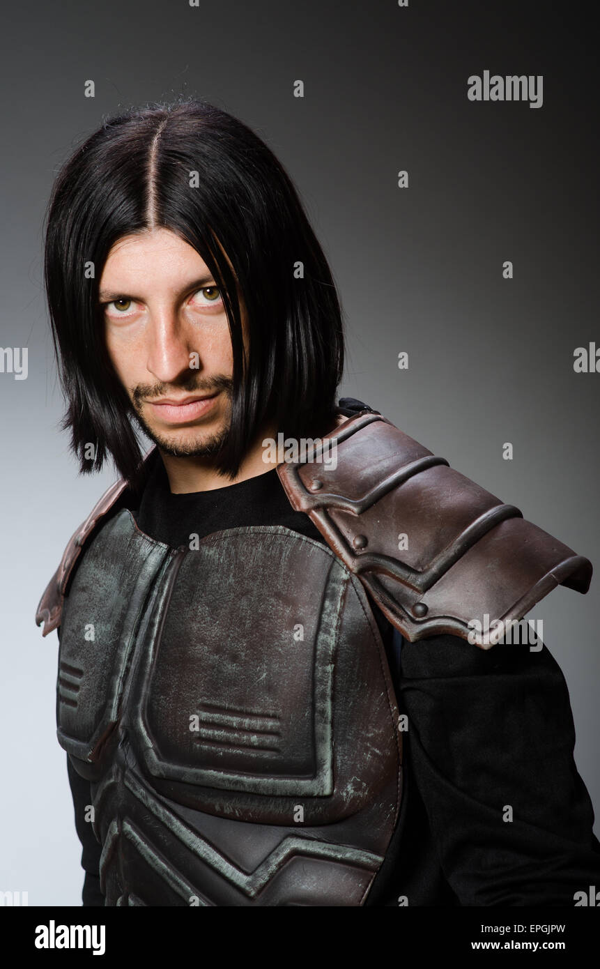 Angry warrior against dark background Stock Photo - Alamy