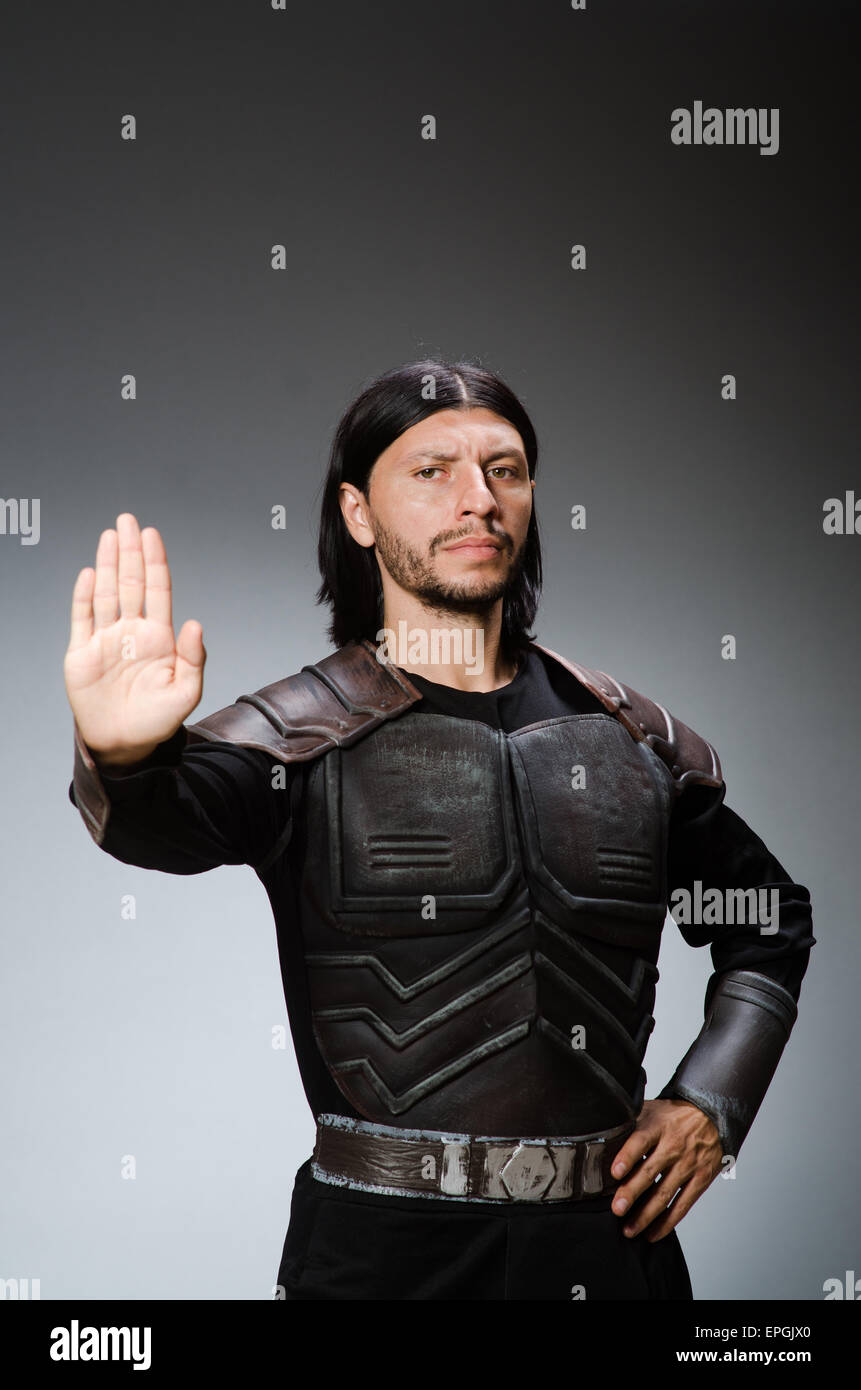 Funny knight against dark background Stock Photo - Alamy