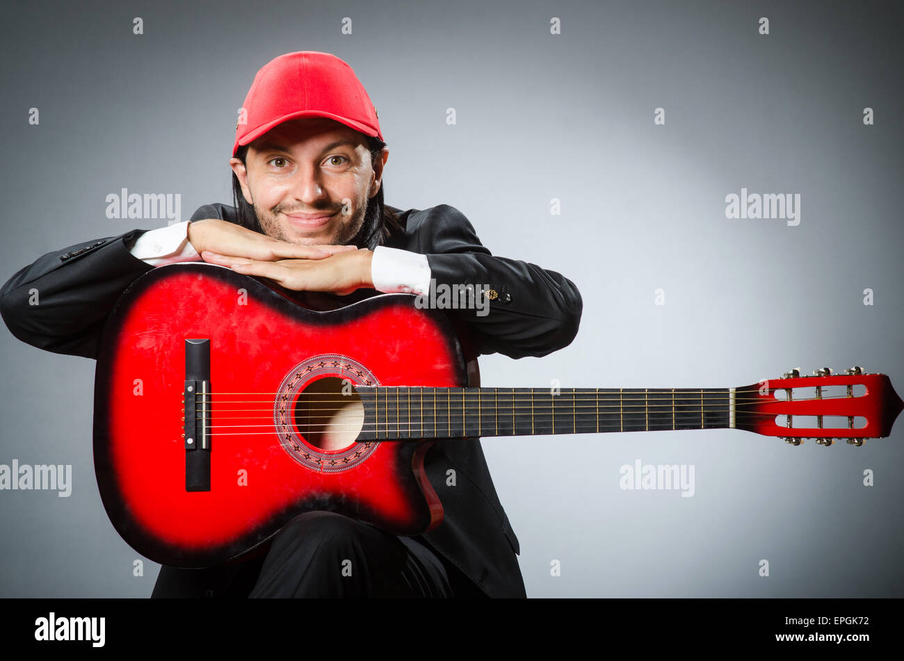 Funny guitar player in studio Stock Photo - Alamy