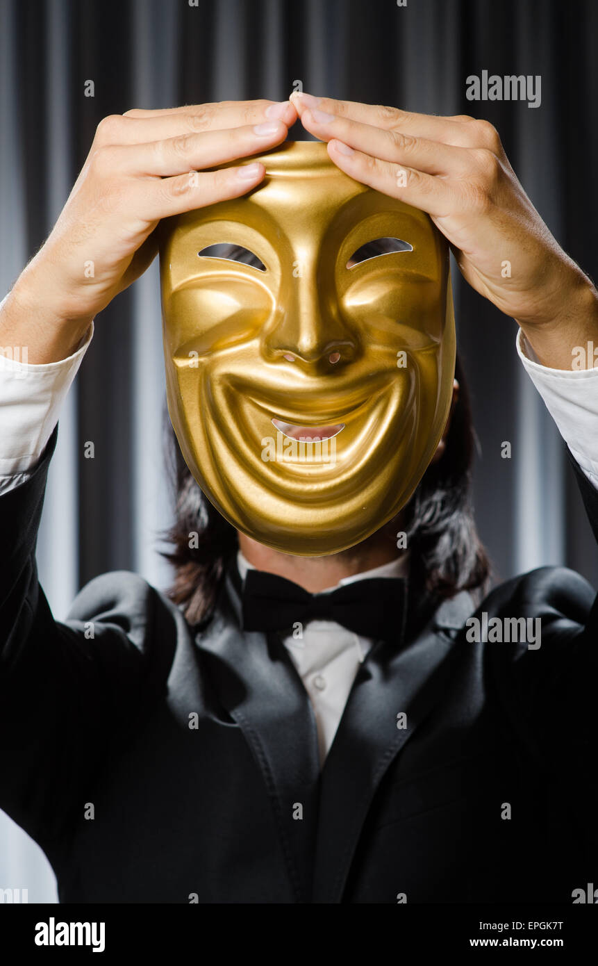 Funny concept with theatrical mask Stock Photo - Alamy