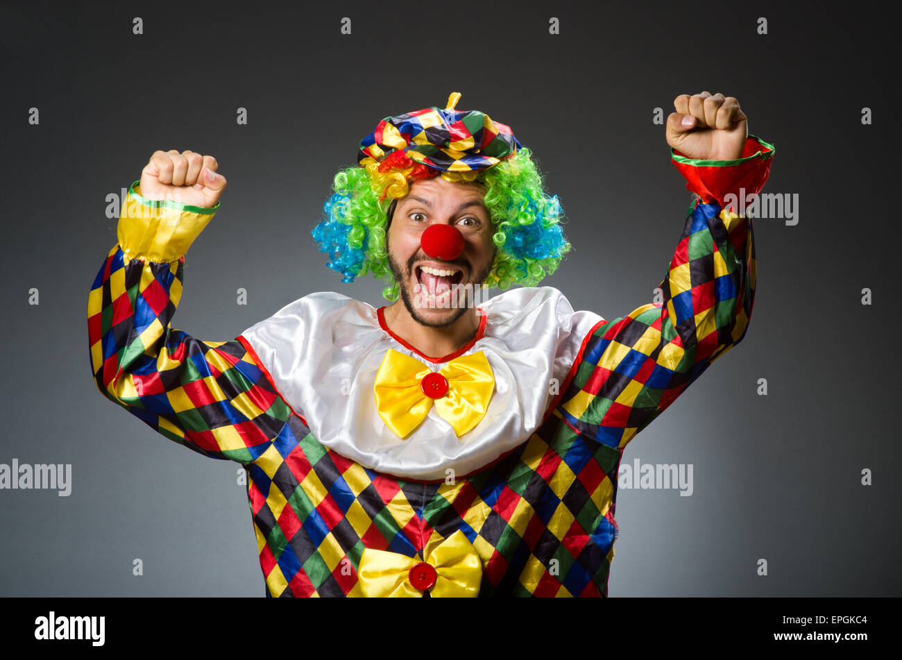 Funny clown in colourful costume Stock Photo - Alamy
