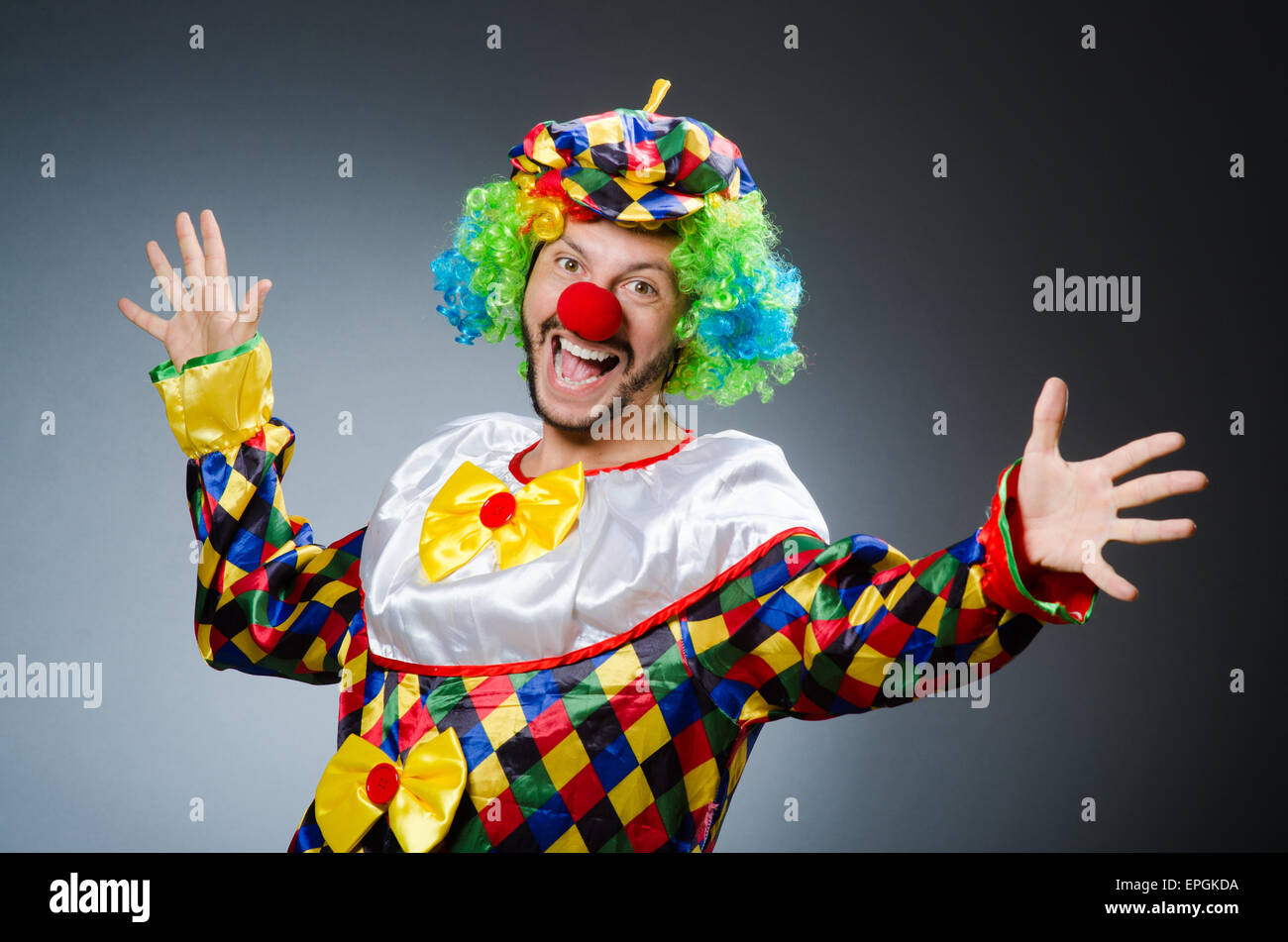 Funny clown in colourful costume Stock Photo - Alamy