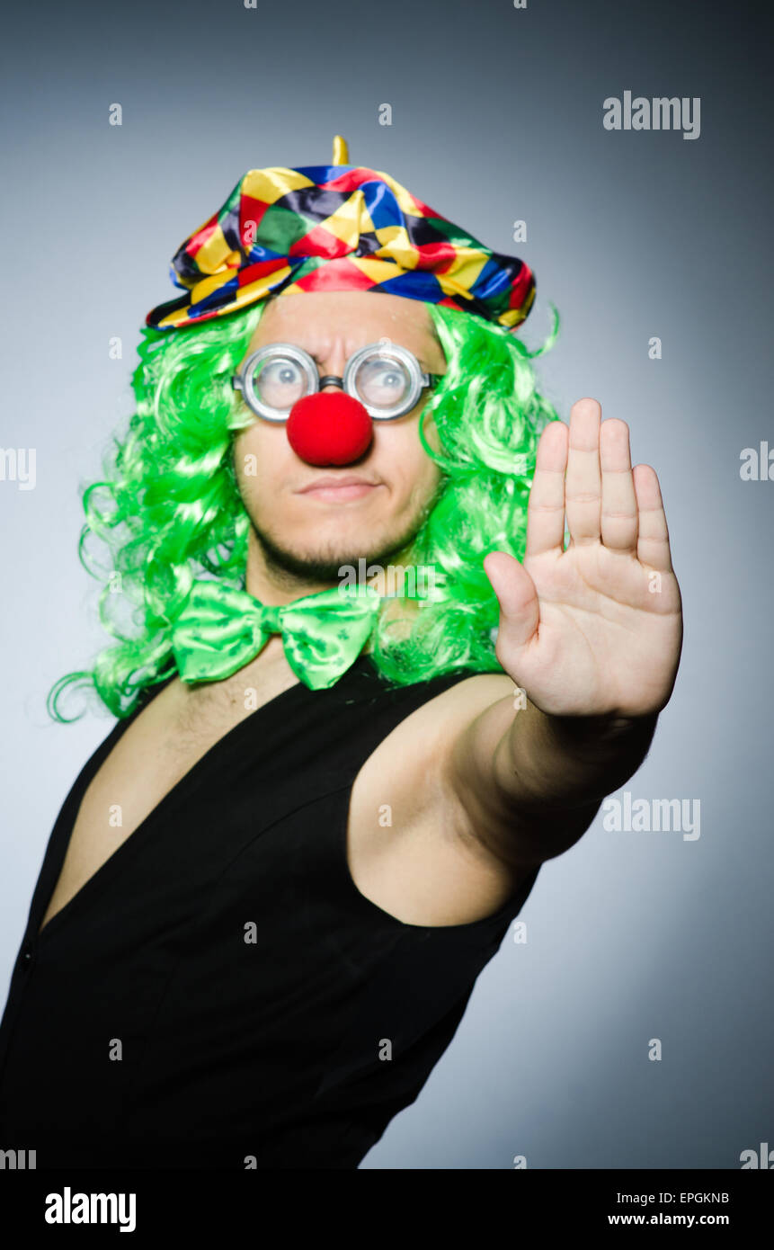 Funny clown against the dark background Stock Photo - Alamy
