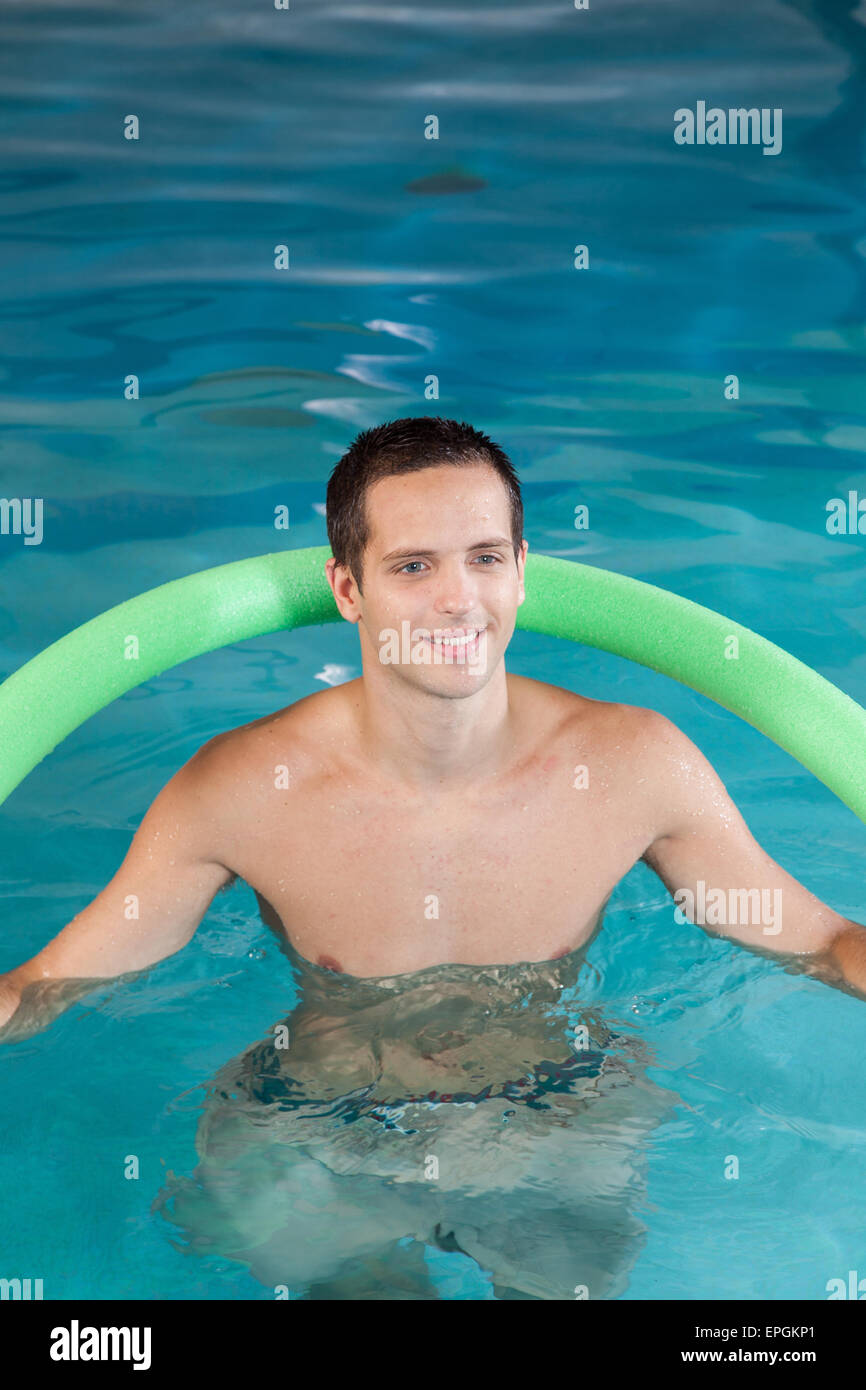 Relaxed man floating in pool hi-res stock photography and images - Alamy