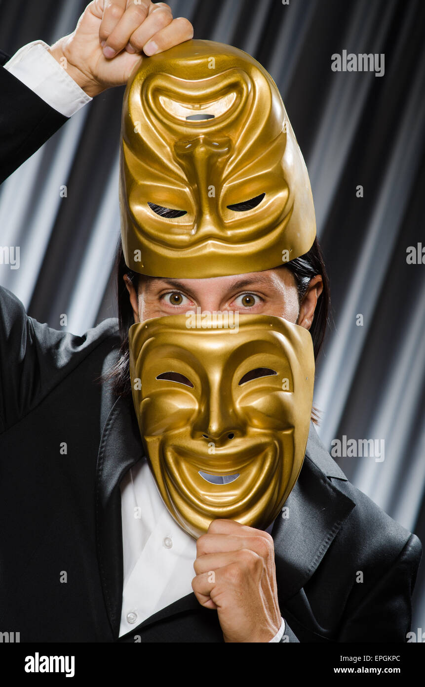Funny concept with theatrical mask Stock Photo - Alamy