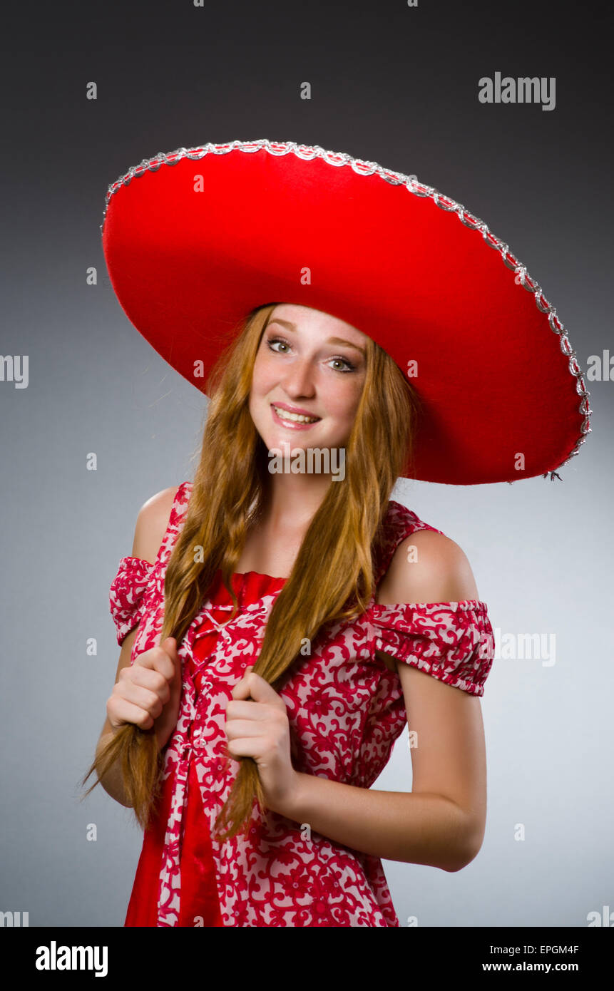 Mexican woman wearing red sombrero Stock Photo - Alamy