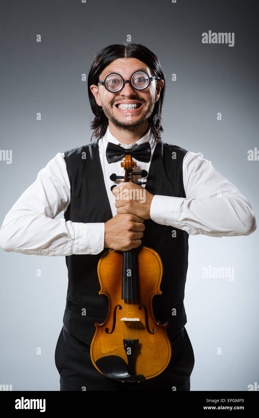 Funny fiddle violin player in musical concept Stock Photo - Alamy