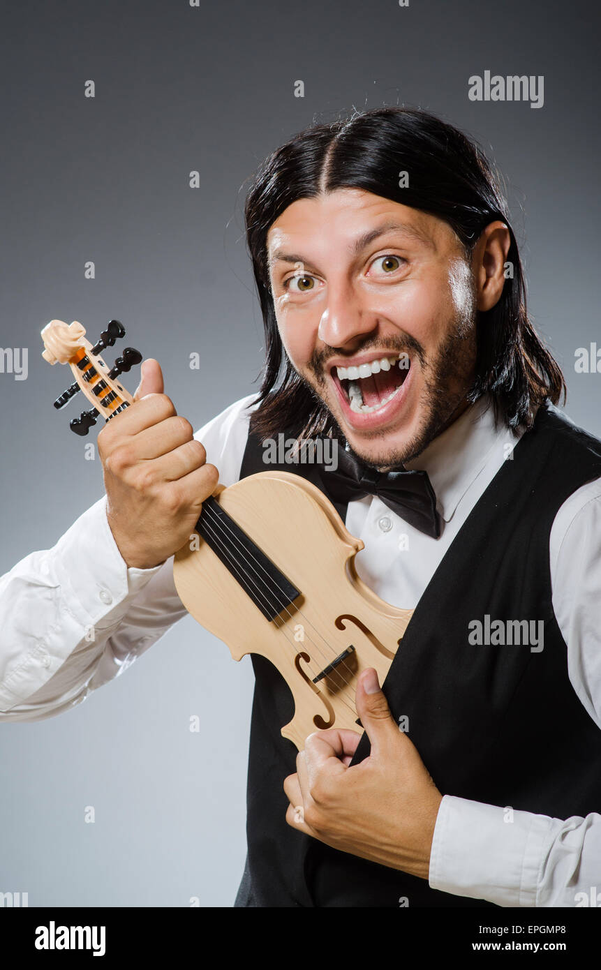 Funny fiddle violin player in musical concept Stock Photo - Alamy